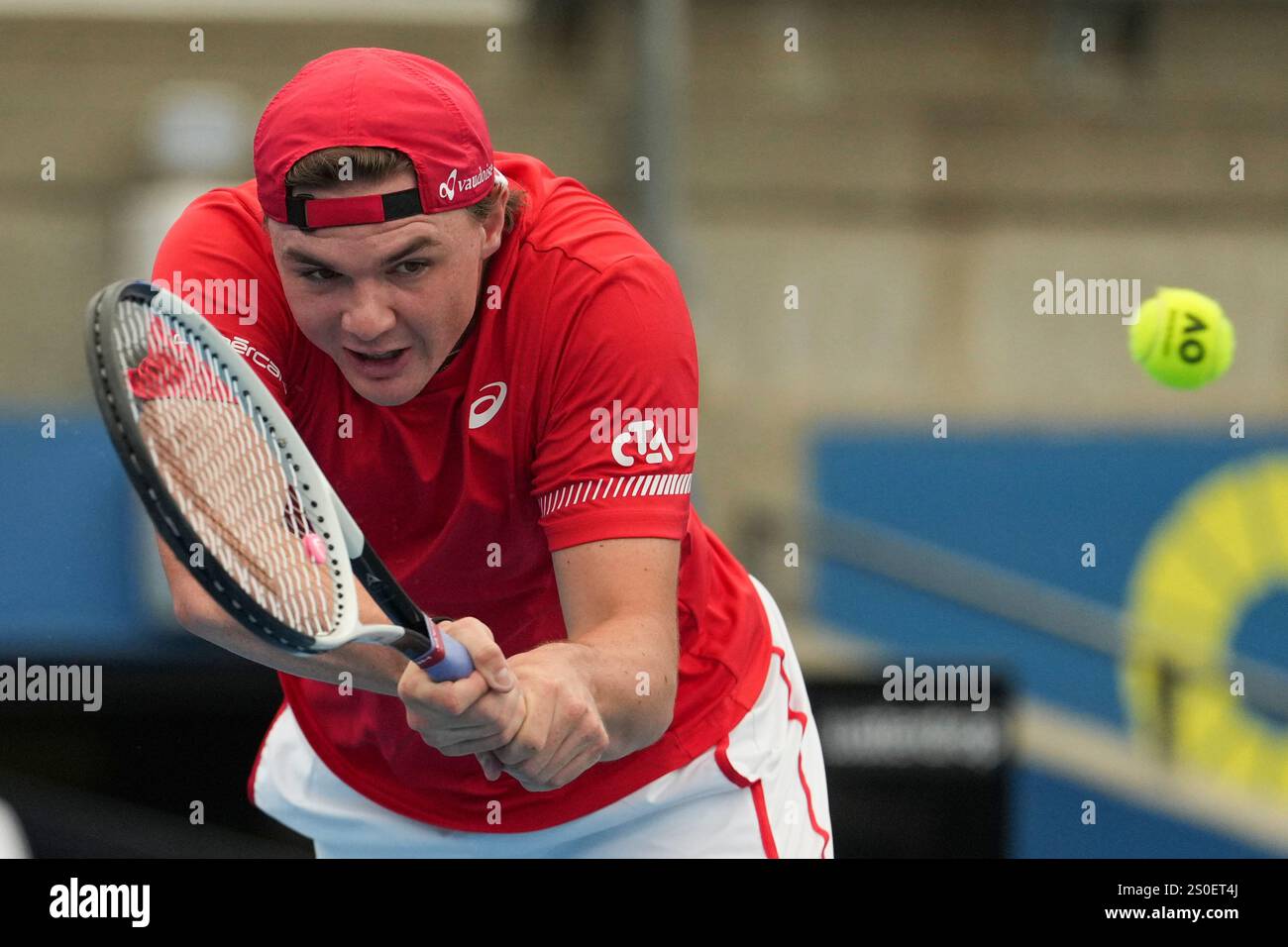 Switzerland's Dominic Stricker plays a backhand return to France's Ugo ...