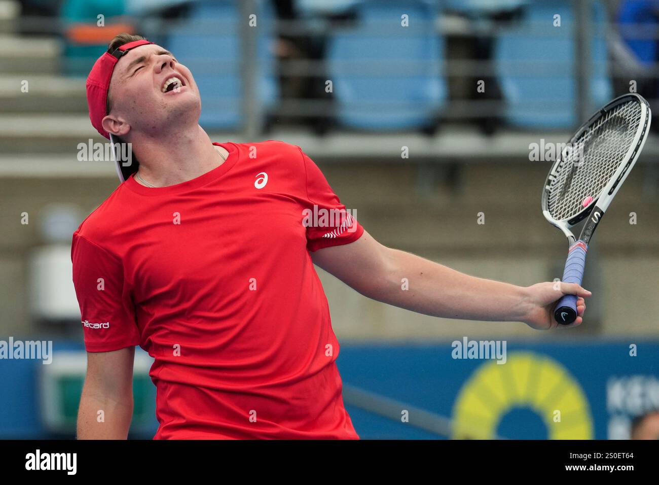 Switzerland's Dominic Stricker reacts after losing a point to France's ...