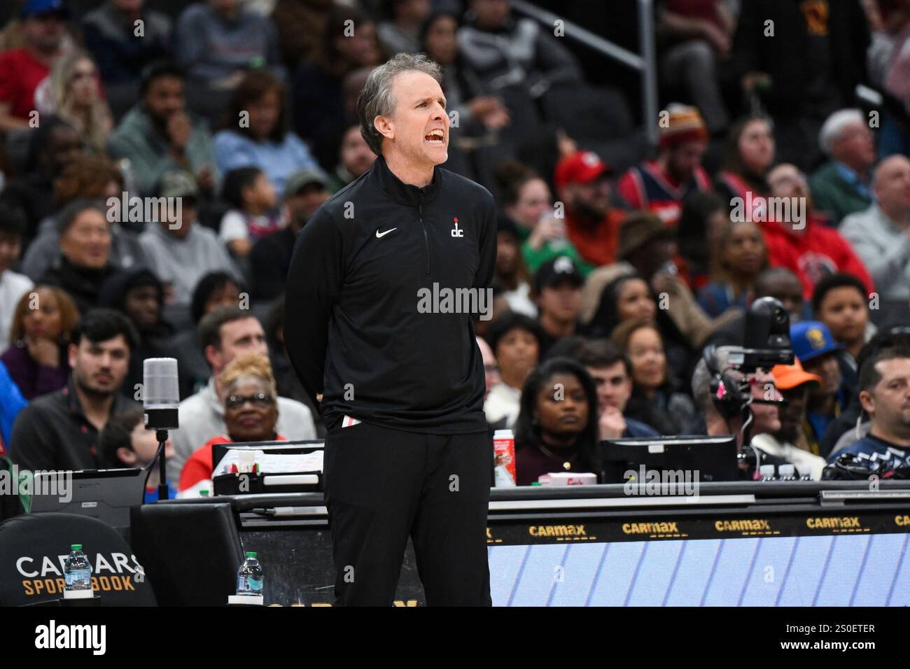 Washington Wizards head coach Brian Keefe gives his team instructions ...