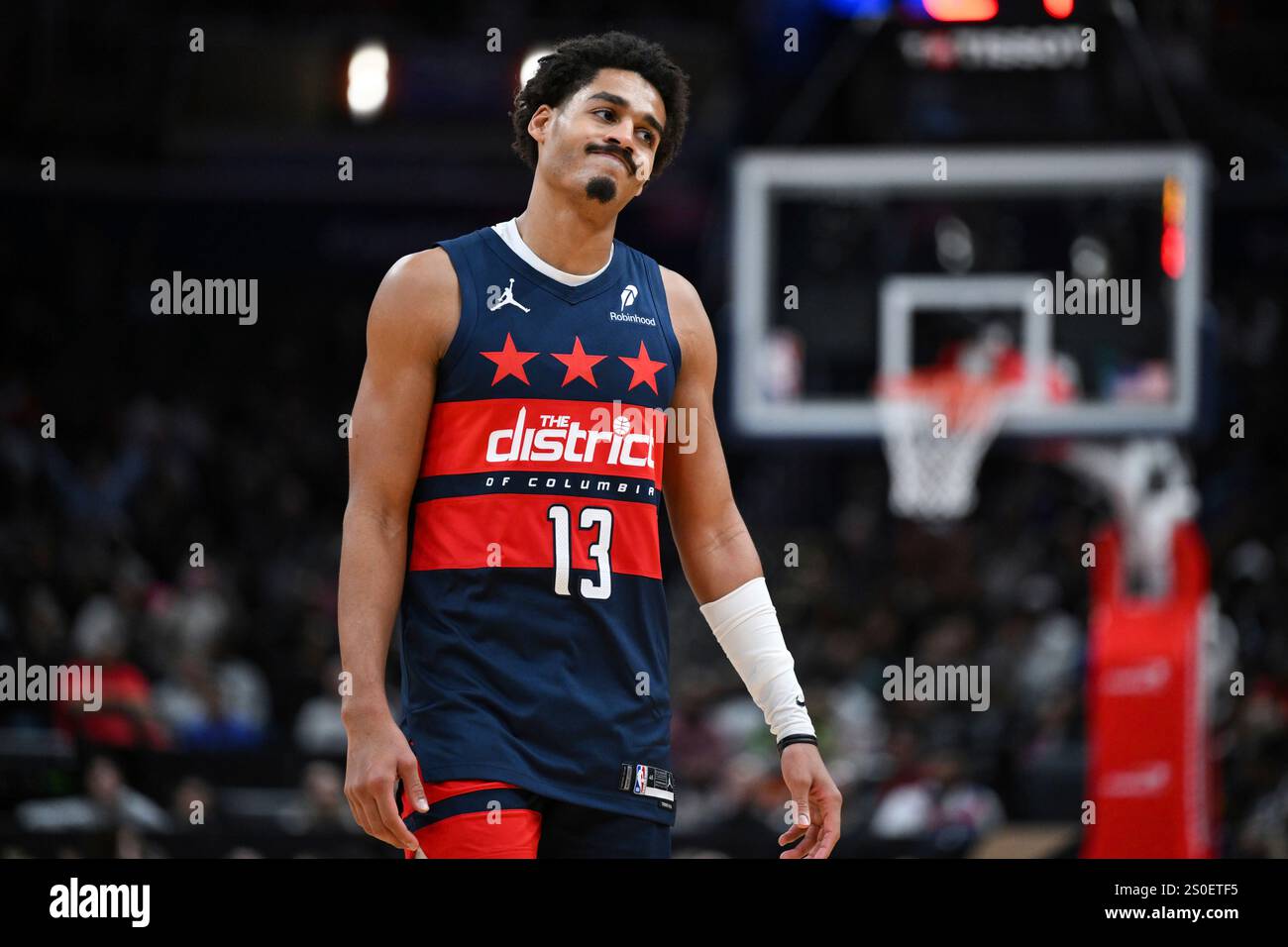 Washington Wizards guard Jordan Poole (13) grimaces after a foul called ...