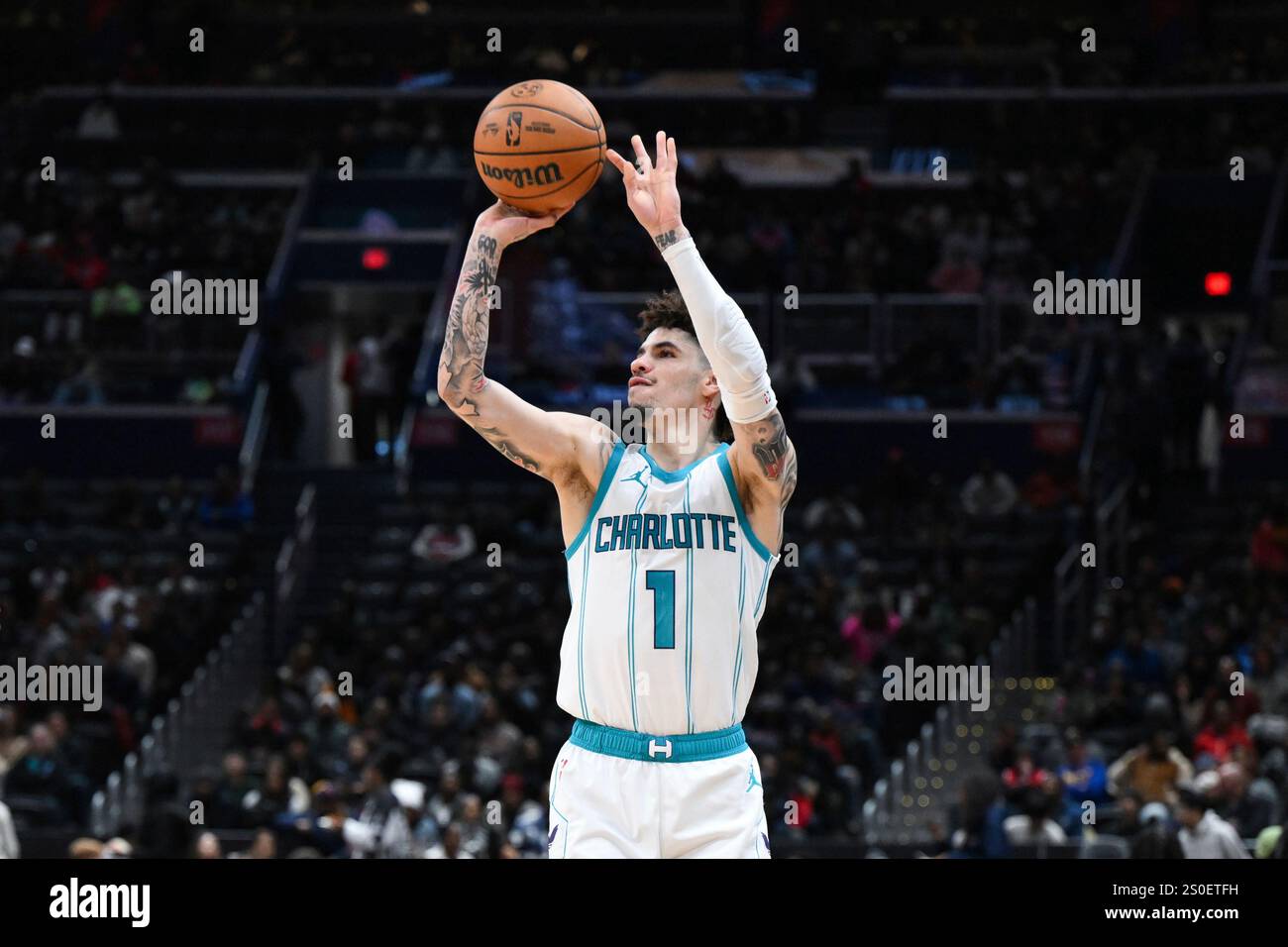 Charlotte Hornets guard LaMelo Ball (1) shoots a three point basket ...