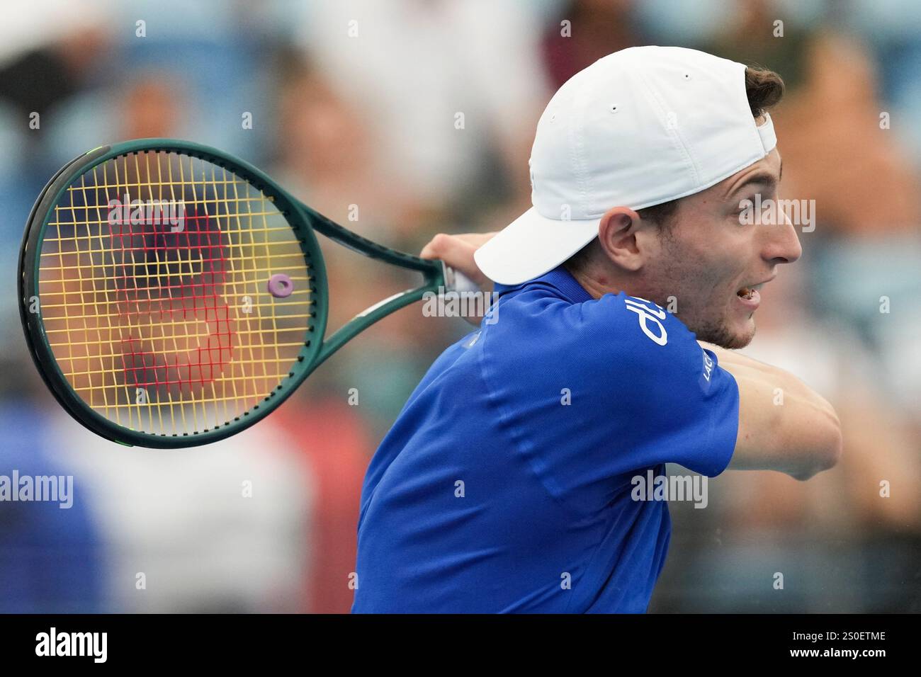 France's Ugo Humbert plays a backhand return to Switzerland's Dominic ...