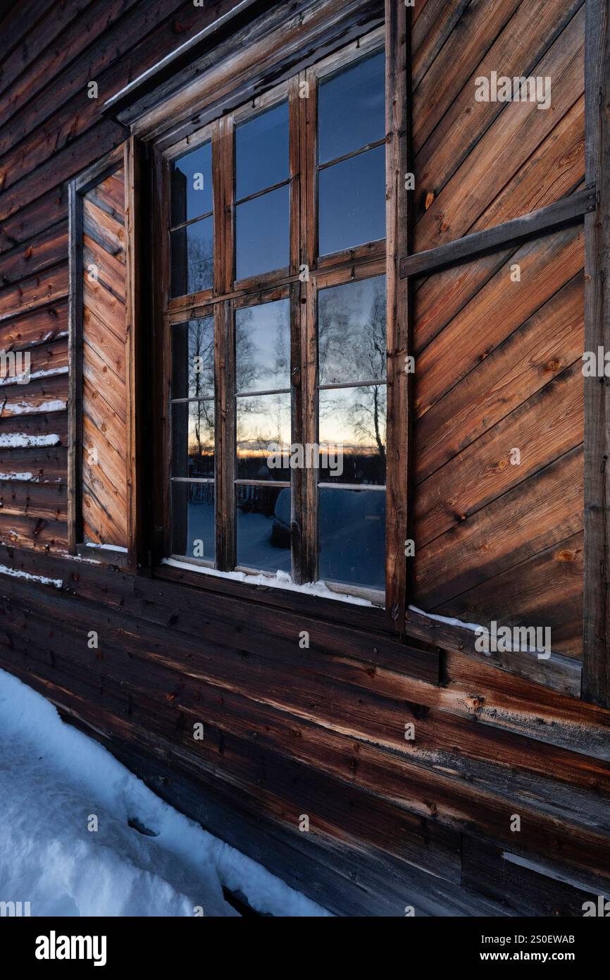Reflections in the window. The wilderness church in Pielpajärvi is the ...