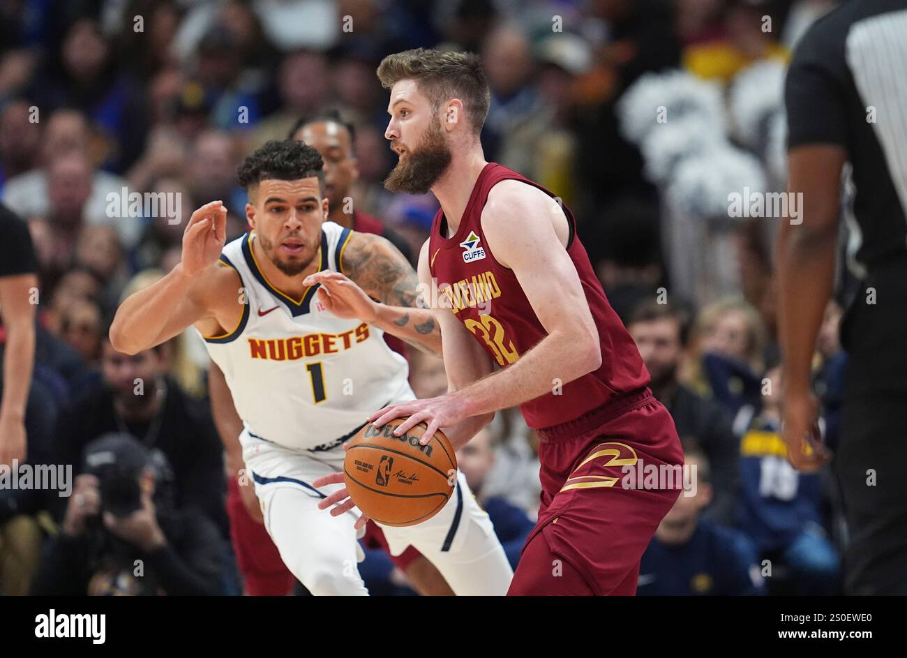 Cleveland Cavaliers forward Dean Wade, center right, looks to pass the ...