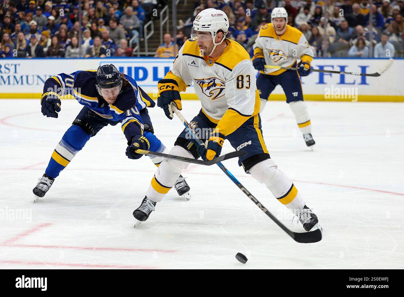 Nashville Predators' Adam Wilsby (83) looks to pass the puck while ...