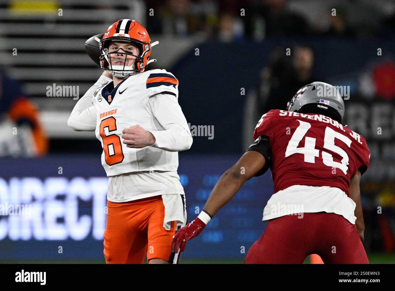 Syracuse quarterback Kyle McCord (6) passes under pressure from Washington State edge Raam ...