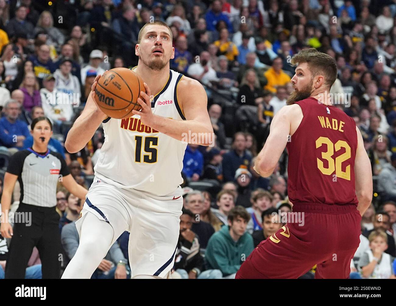 Denver Nuggets center Nikola Jokic, left, drives to the basket past ...
