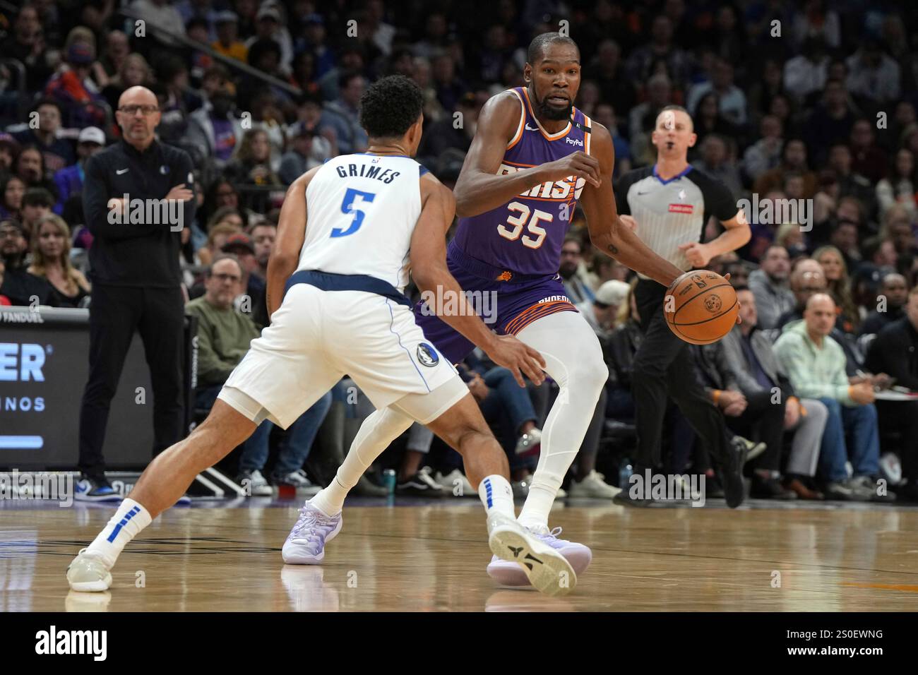 Phoenix Suns forward Kevin Durant drives on Dallas Mavericks guard ...