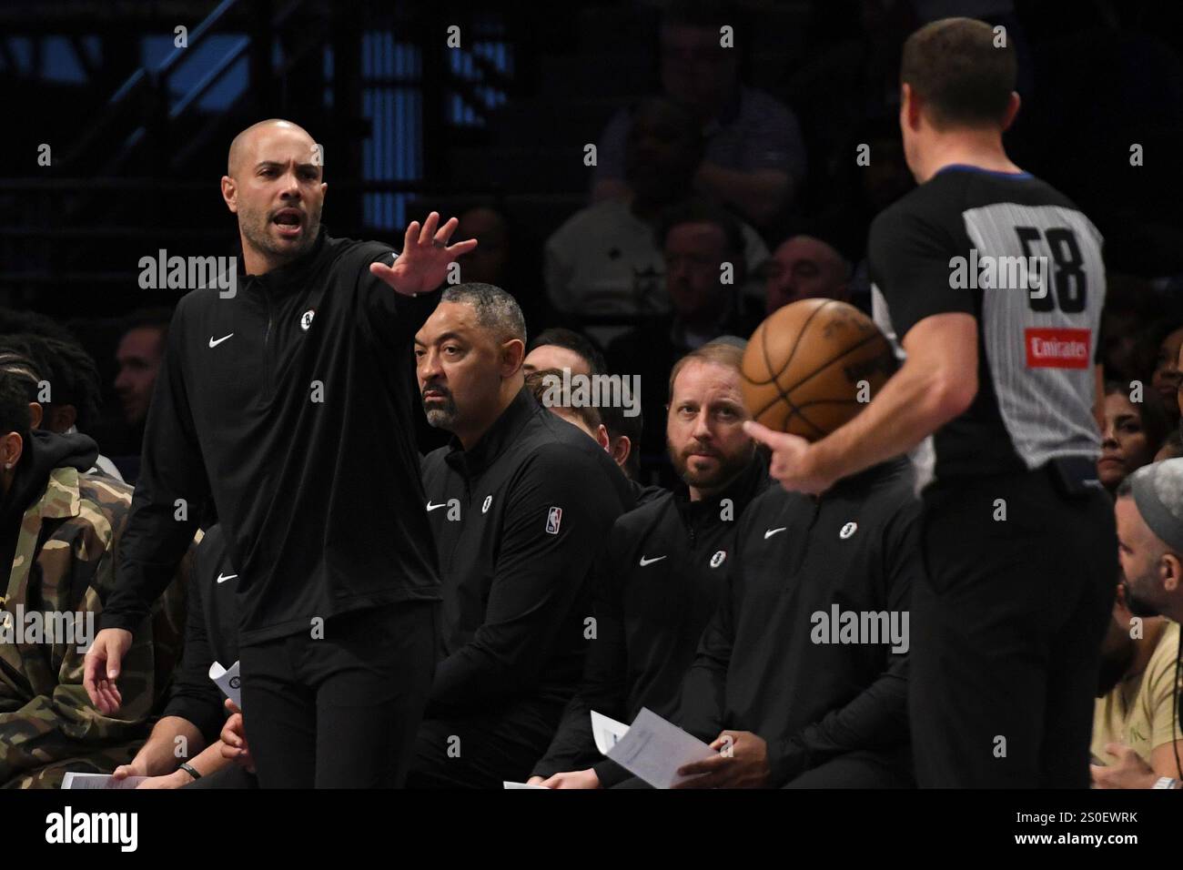Brooklyn Nets head coach Jordi Fernandez, left, speaks to a referee (58 ...