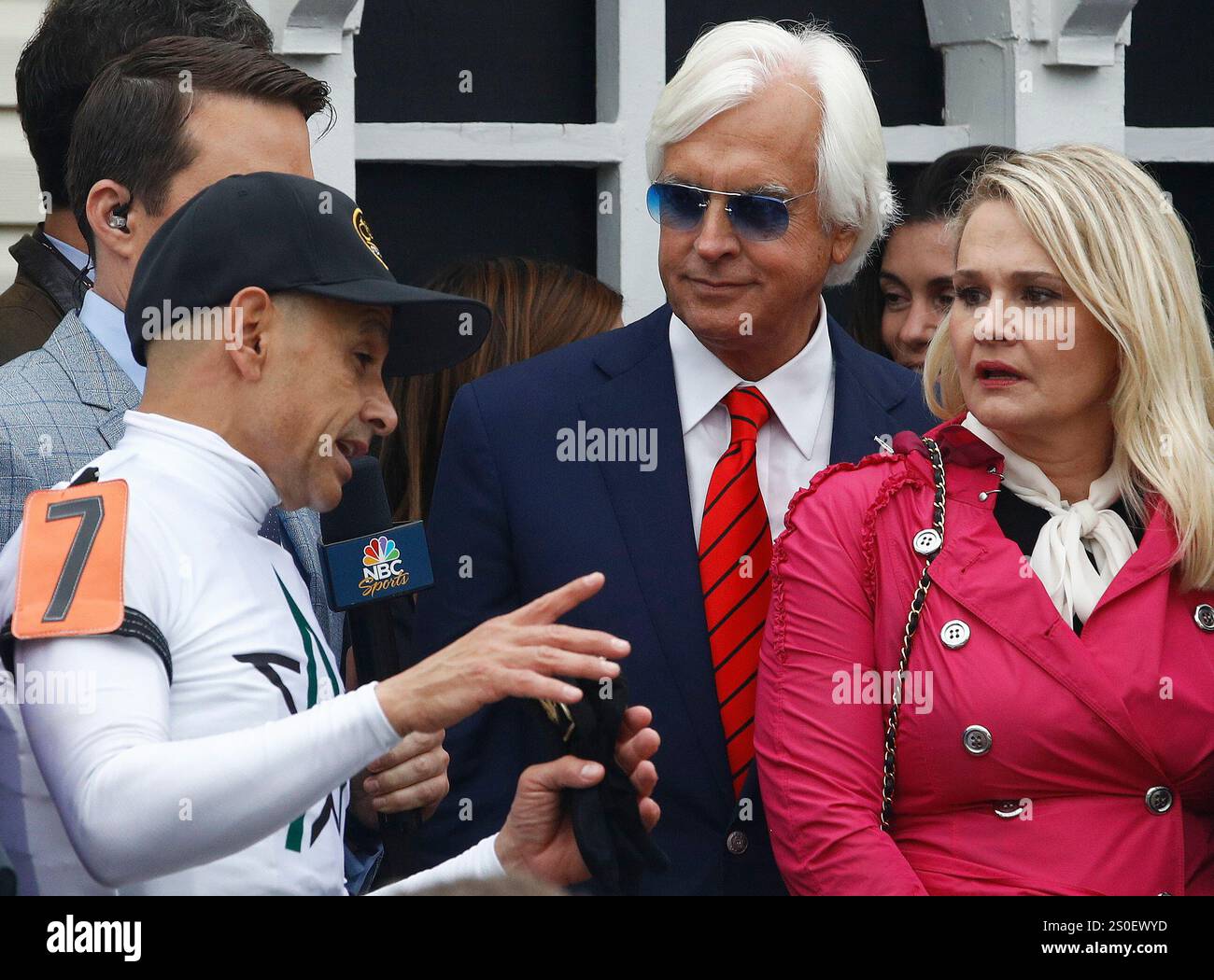 FILE - Jockey Mike Smith, left, speaks with trainer Bob Baffert, center ...