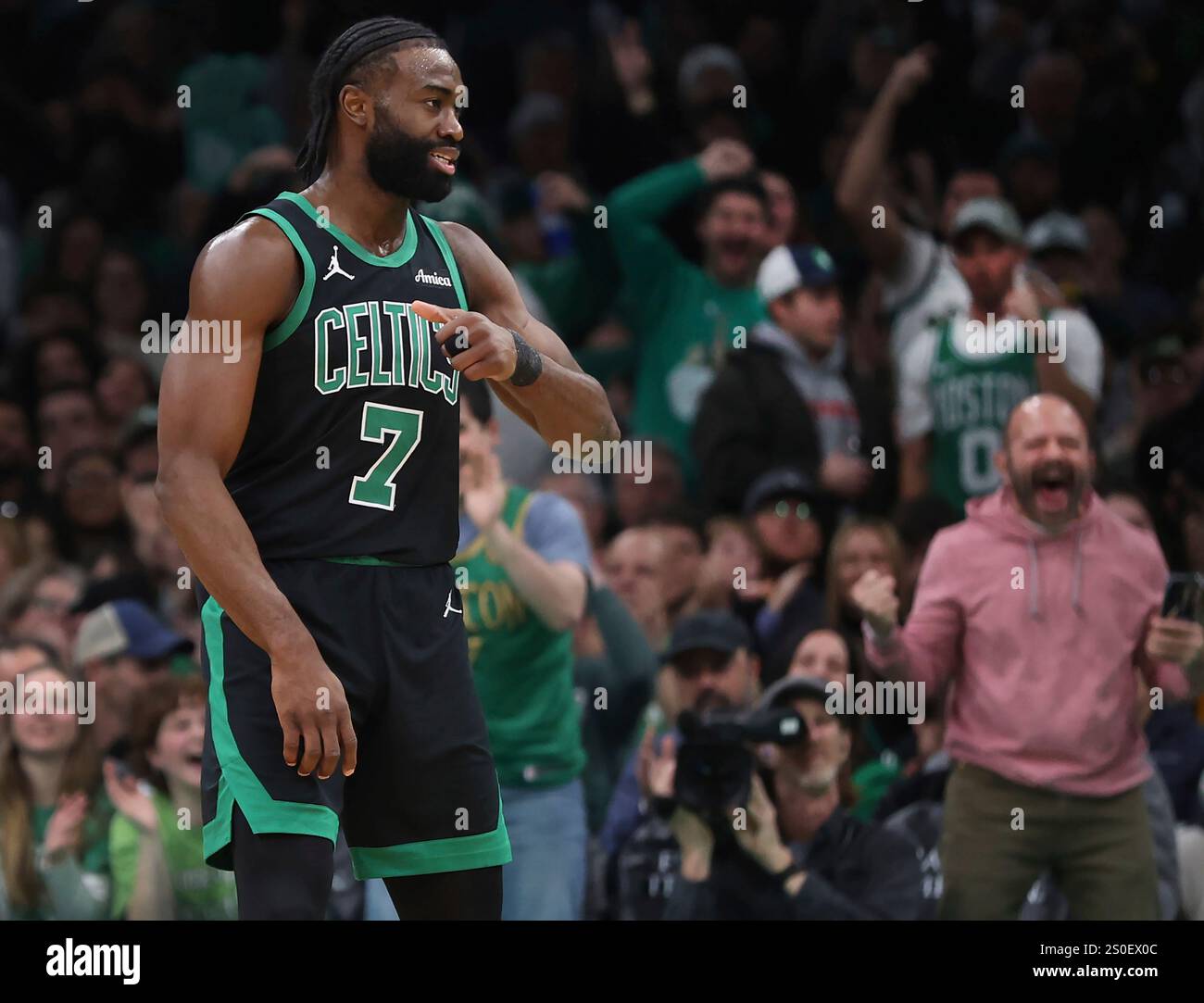 Boston Celtics forward Jaylen Brown smiles after he hit a first quarter ...