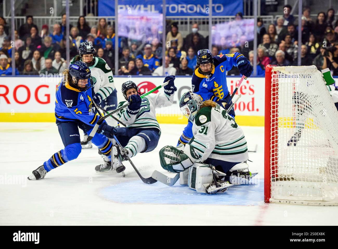 Boston Fleet's Hadley Hartmetz (6) falls on the ice as Toronto Sceptres ...