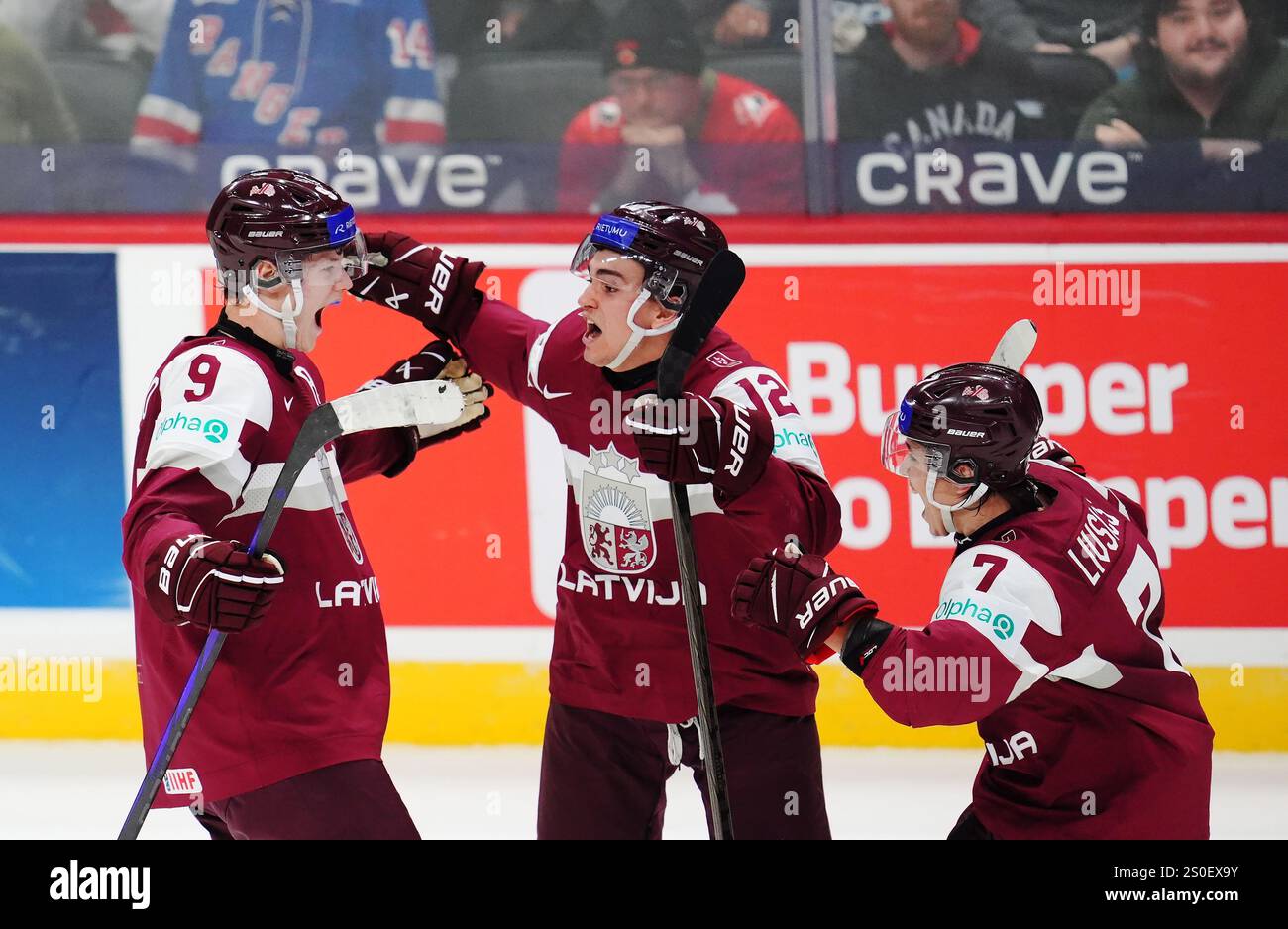 Ottawa, Canada. 27th Dec, 2024. Latvia's Eriks Mateiko (left ...