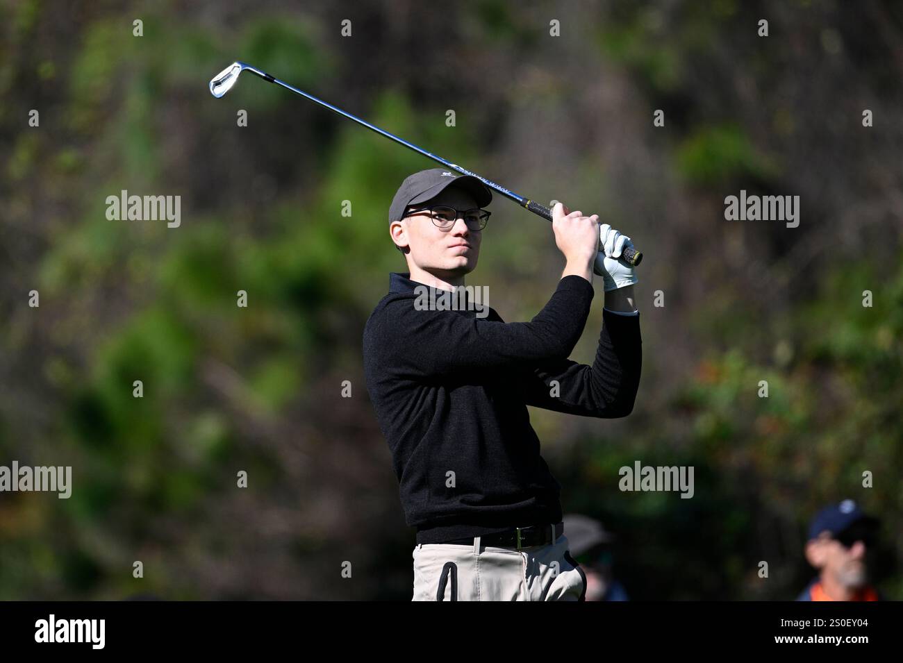 Jason Langer watches his tee shot on the fifth hole during the first ...