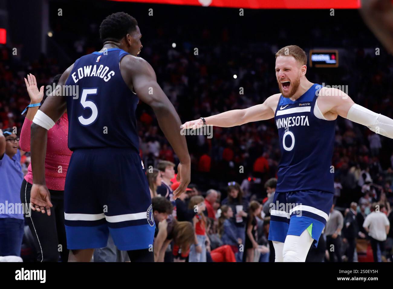 Minnesota Timberwolves guards Anthony Edwards (5) and Donte DiVincenzo ...