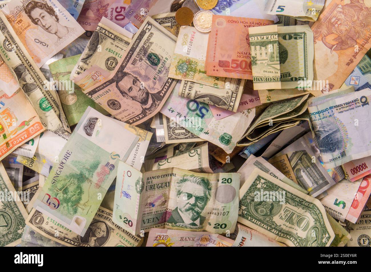 International foreign currency bills and coins in the donations box at ...