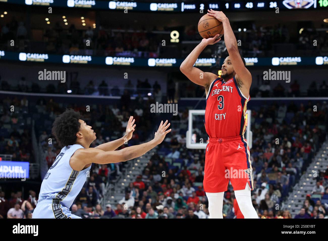 New Orleans Pelicans guard CJ McCollum (3) goes up to shoot a 3-point ...