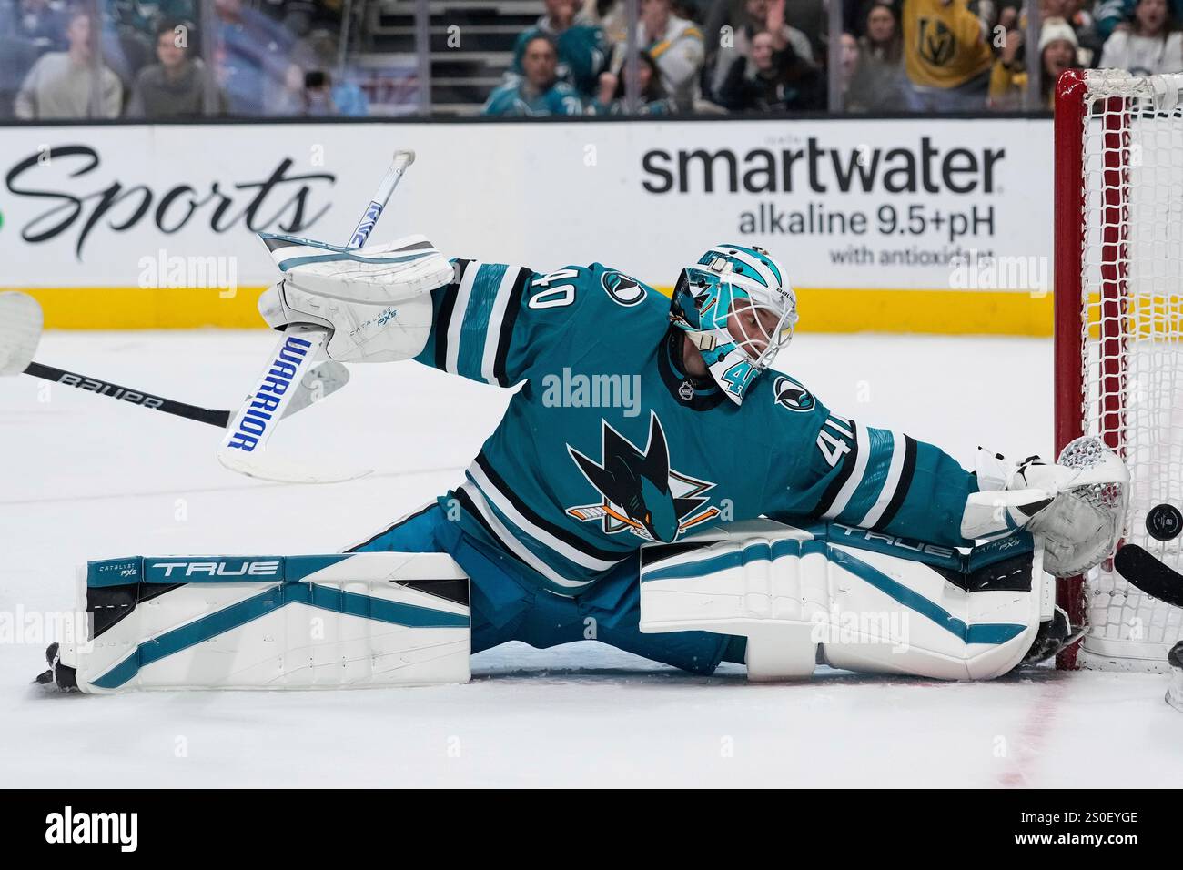 San Jose Sharks goaltender Alexandar Georgiev (40) deflects a shot ...