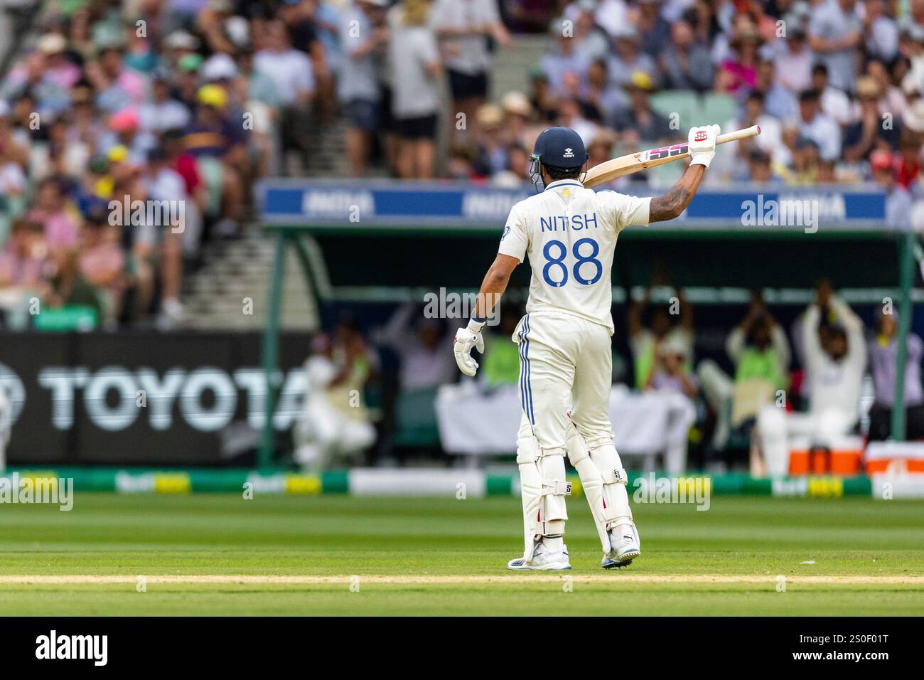 MELBOURNE, AUSTRALIA - DECEMBER 28: Nitish Kumar Reddy of India raises ...