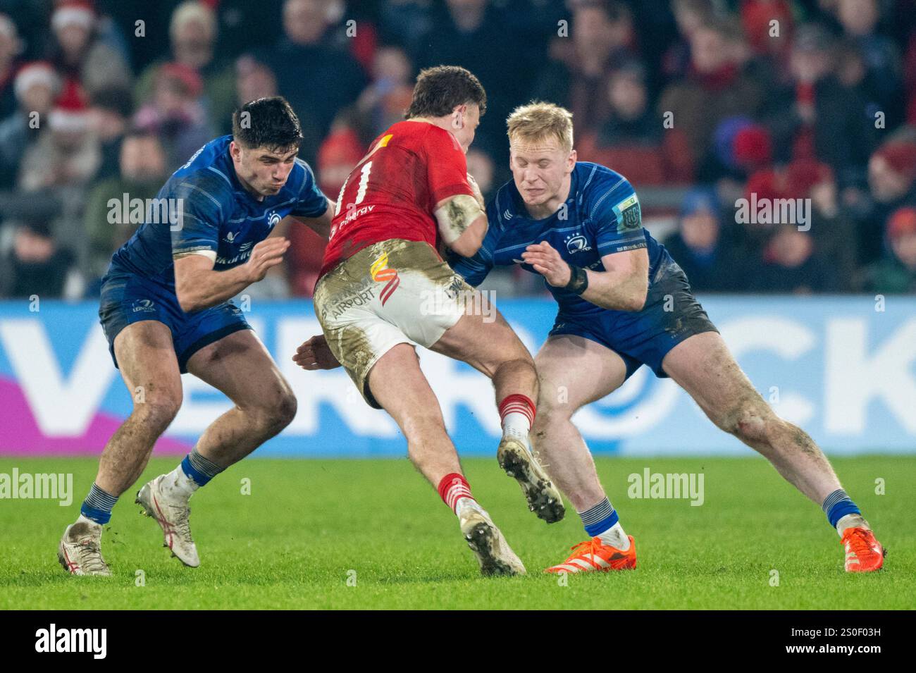 Limerick, Ireland. 28th Dec, 2024. Shane Daly of Munster tackled by ...