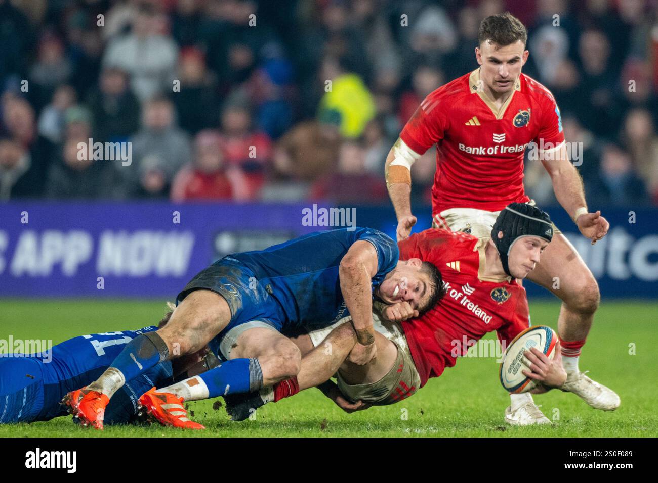 Limerick, Ireland. 28th Dec, 2024. Mike Haley of Munster tackled by ...