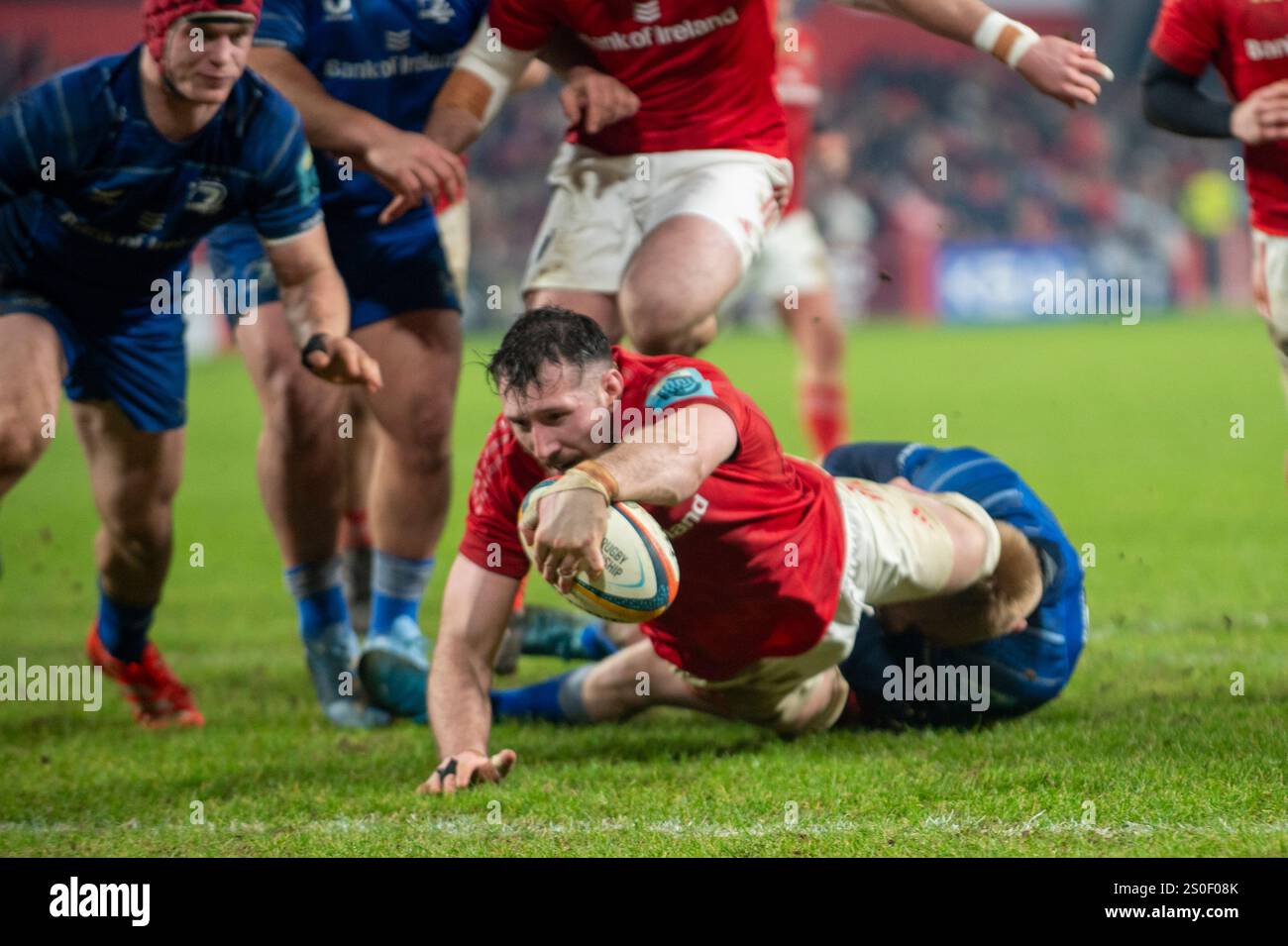 Limerick, Ireland. 28th Dec, 2024. Tom Ahern of Munster scores a try ...