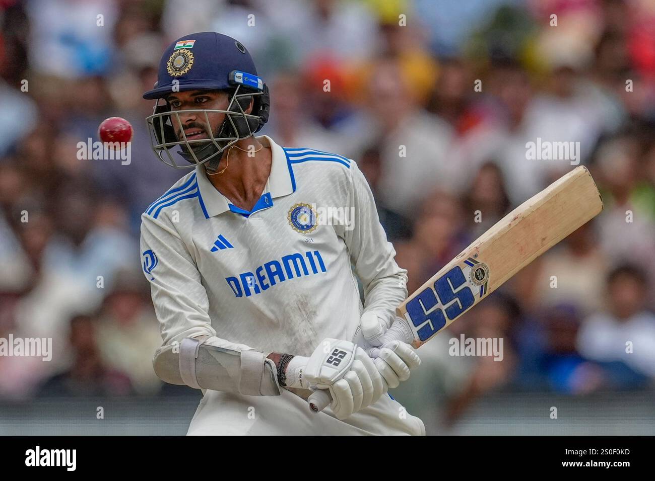 India's Washington Sundar watches the ball as he bats during play on ...