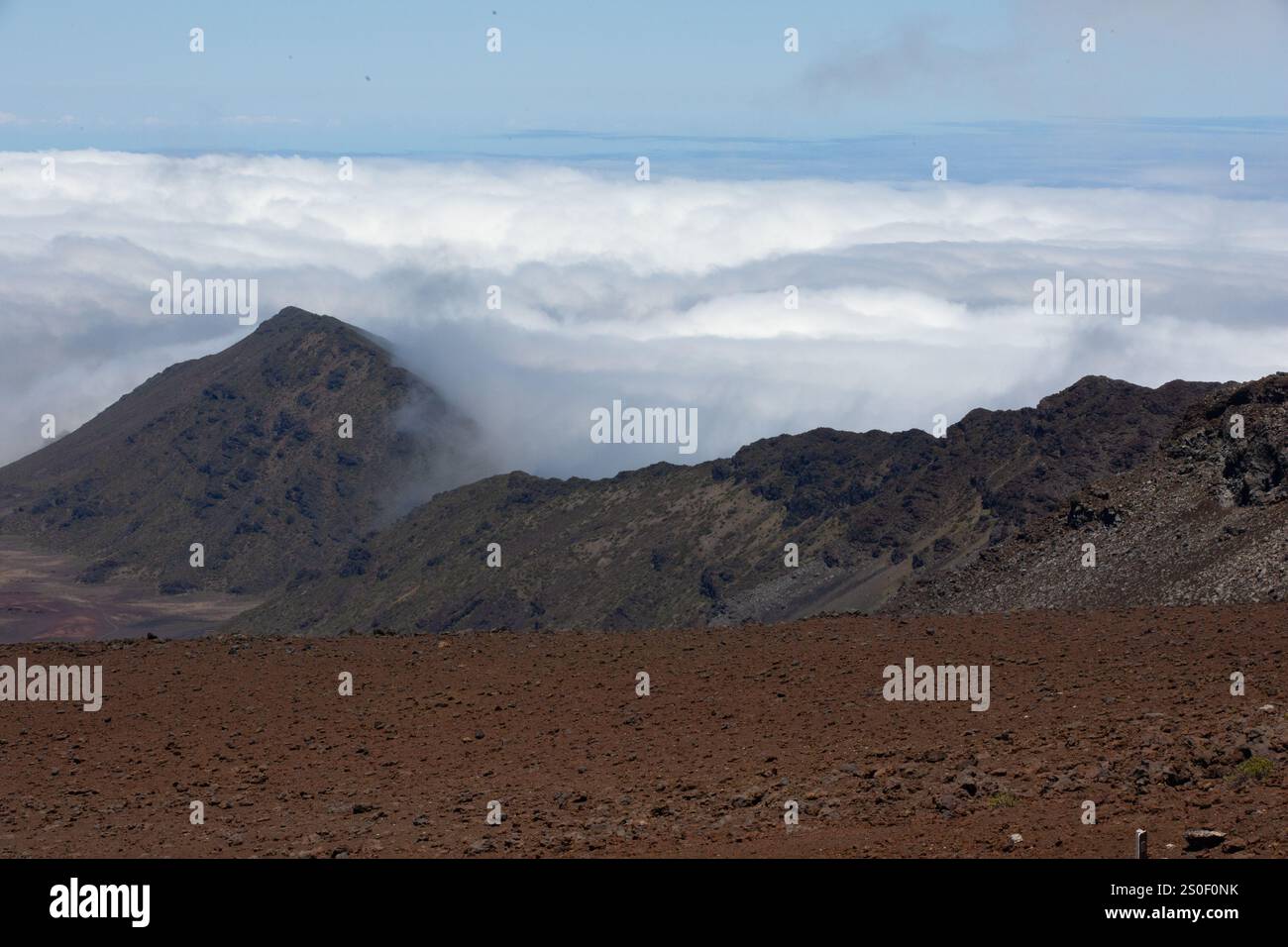 The rugged terrain of the Haleakala mountain range surrounded by ...