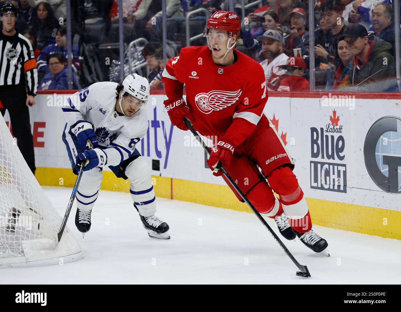 Detroit Red Wings defenseman Simon Edvinsson (77) is pursued by Toronto ...