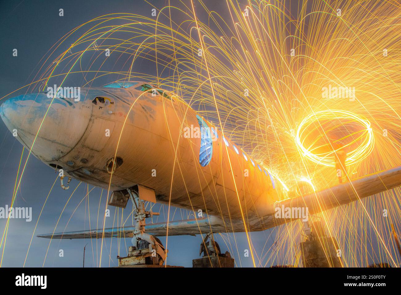 The plane is on fire. Fire show on an old plane. Fireworks on an ...