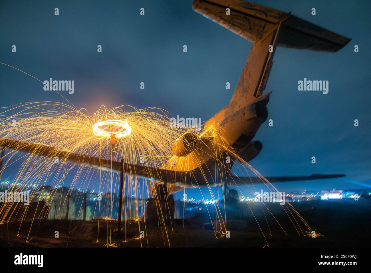 The plane is on fire. Fire show on an old plane. Fireworks on an ...