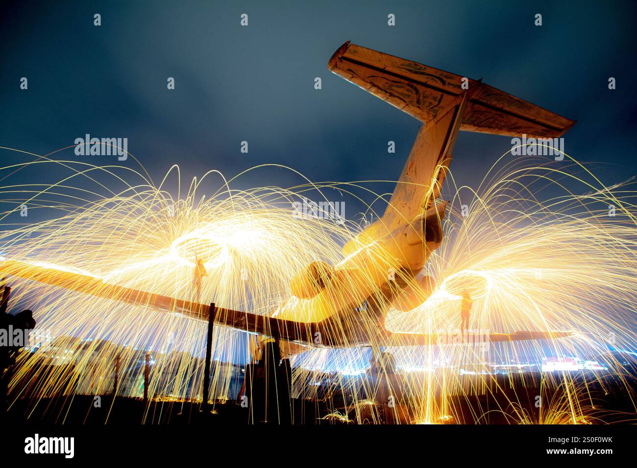 The plane is on fire. Fire show on an old plane. Fireworks on an ...