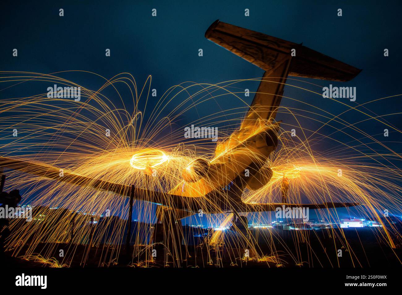 The plane is on fire. Fire show on an old plane. Fireworks on an ...