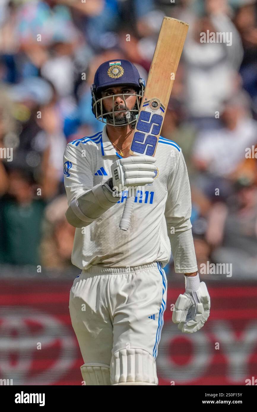 India's Washington Sundar raises his bat after scoring half century ...