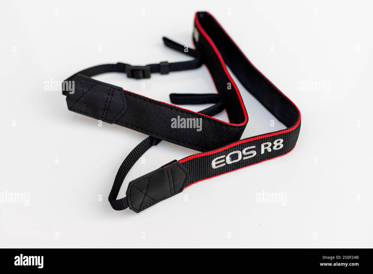 Canon EOS R8 camera neck strap on white isolated background with copy ...
