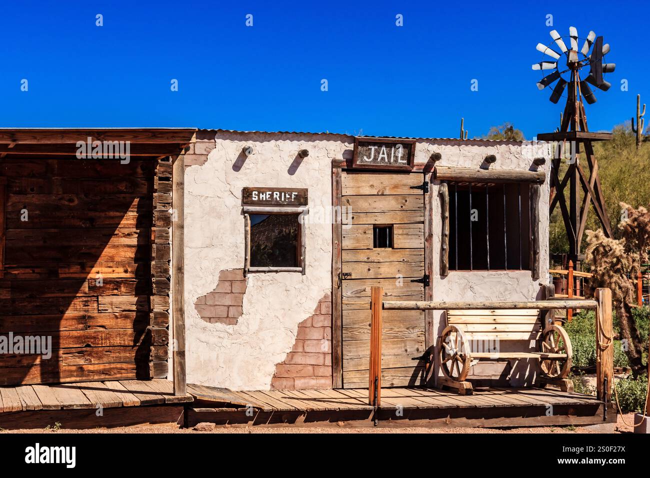 A small shack with a sign that says Jail. The shack is made of wood and ...