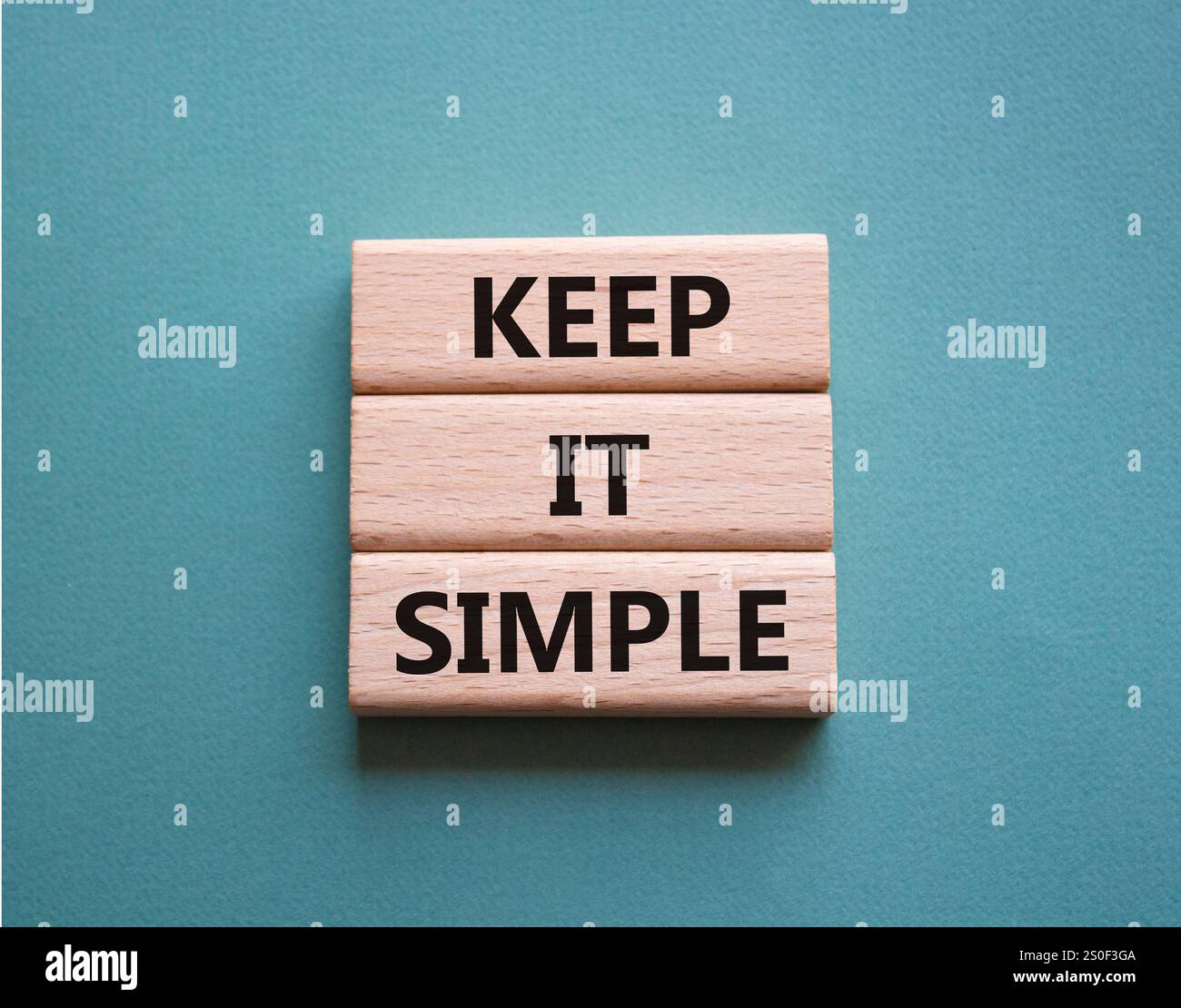 Keep it Simple symbol. Concept words Keep it Simple on wooden blocks ...