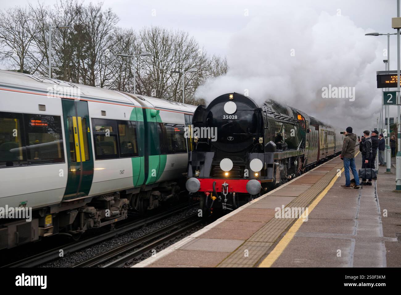 Merchant Navy class locomotive, Clan Line, speeds through Hassocks ...