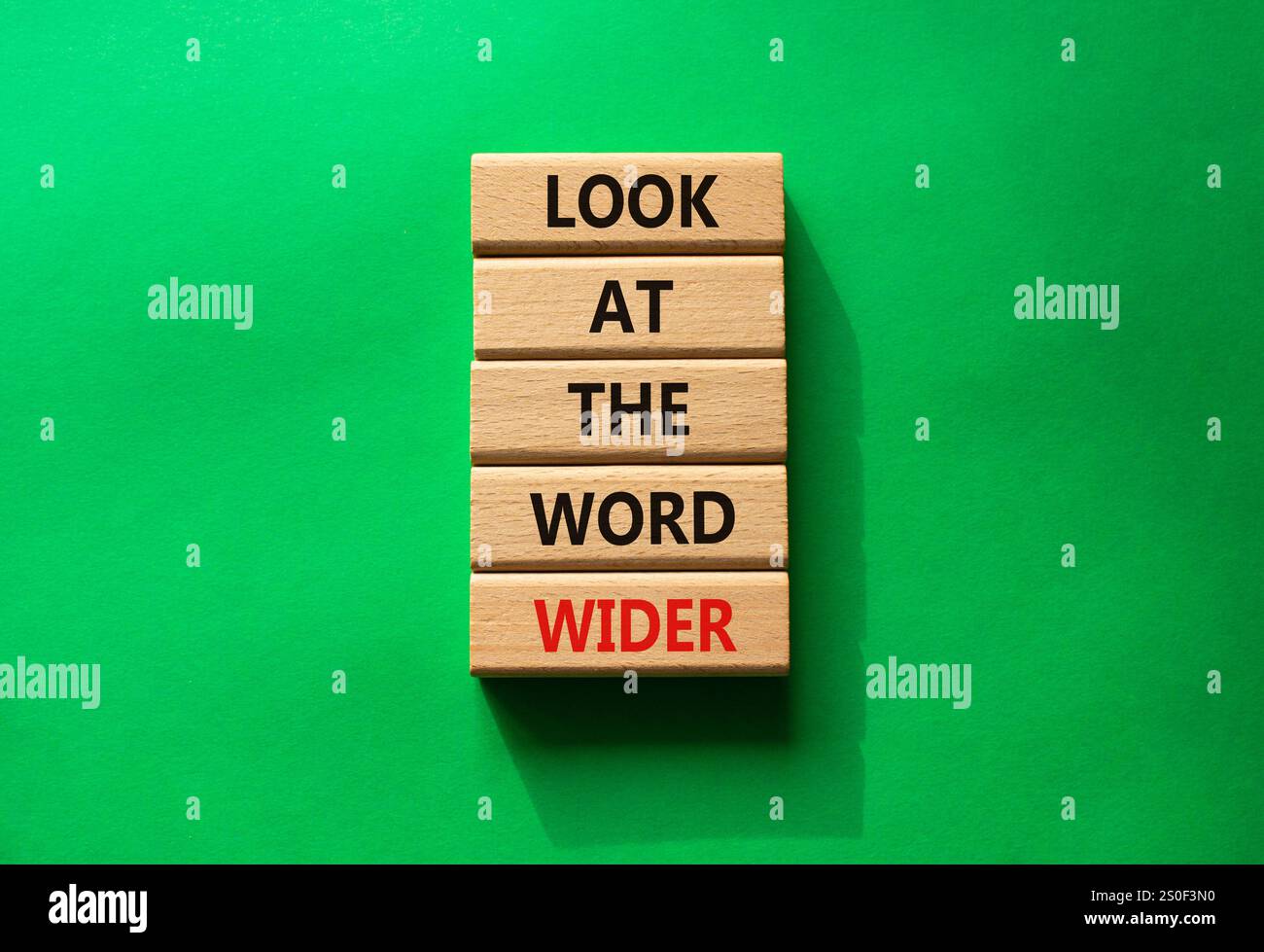 Look at the world wider symbol. Wooden blocks with words Look at the ...