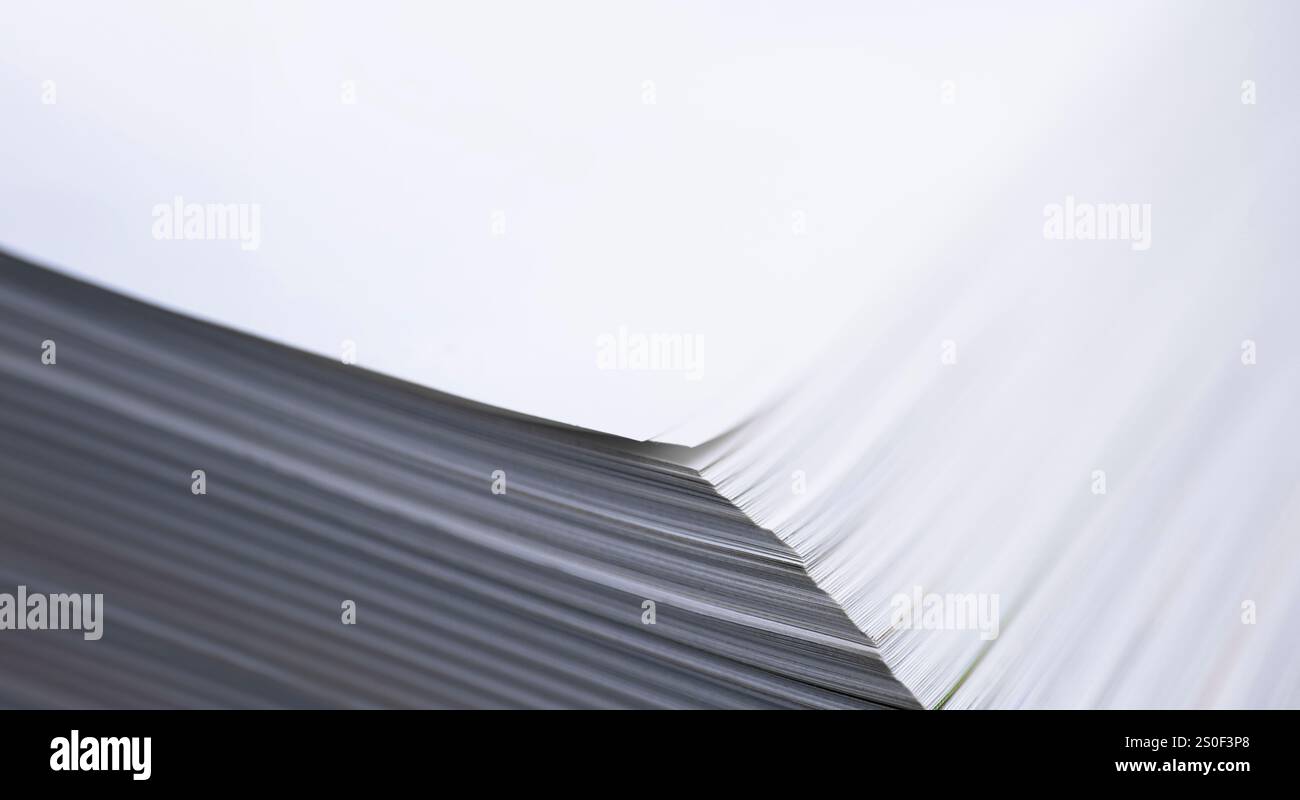 Stack of blank white papers or pages in a book. Photographed diagonally ...