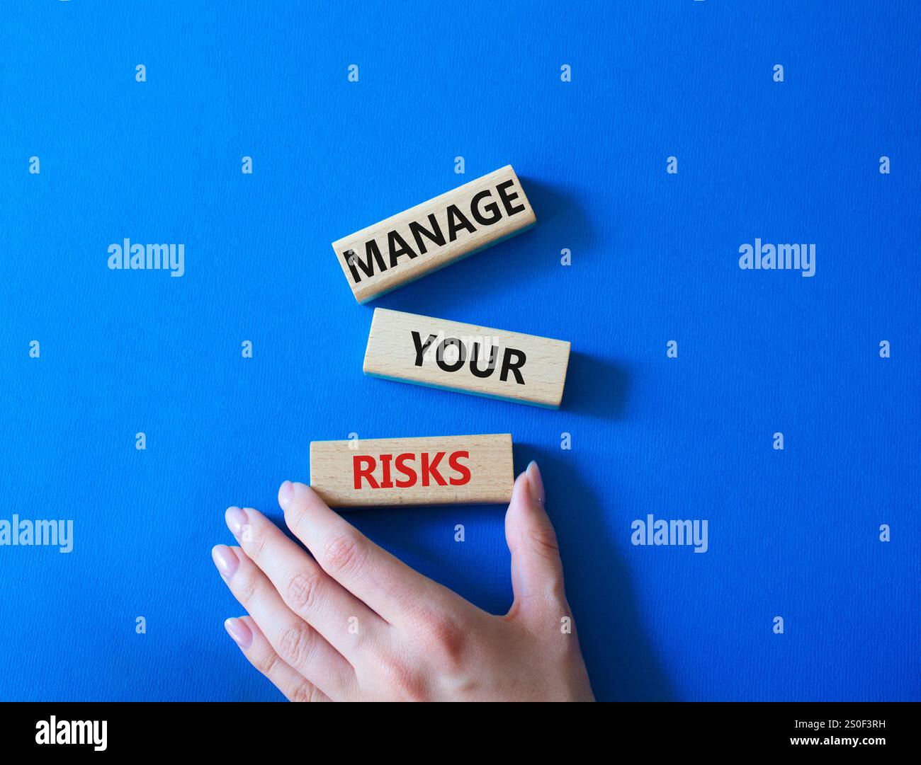 Manage your Risks symbol. Concept words Manage your Risks on wooden ...