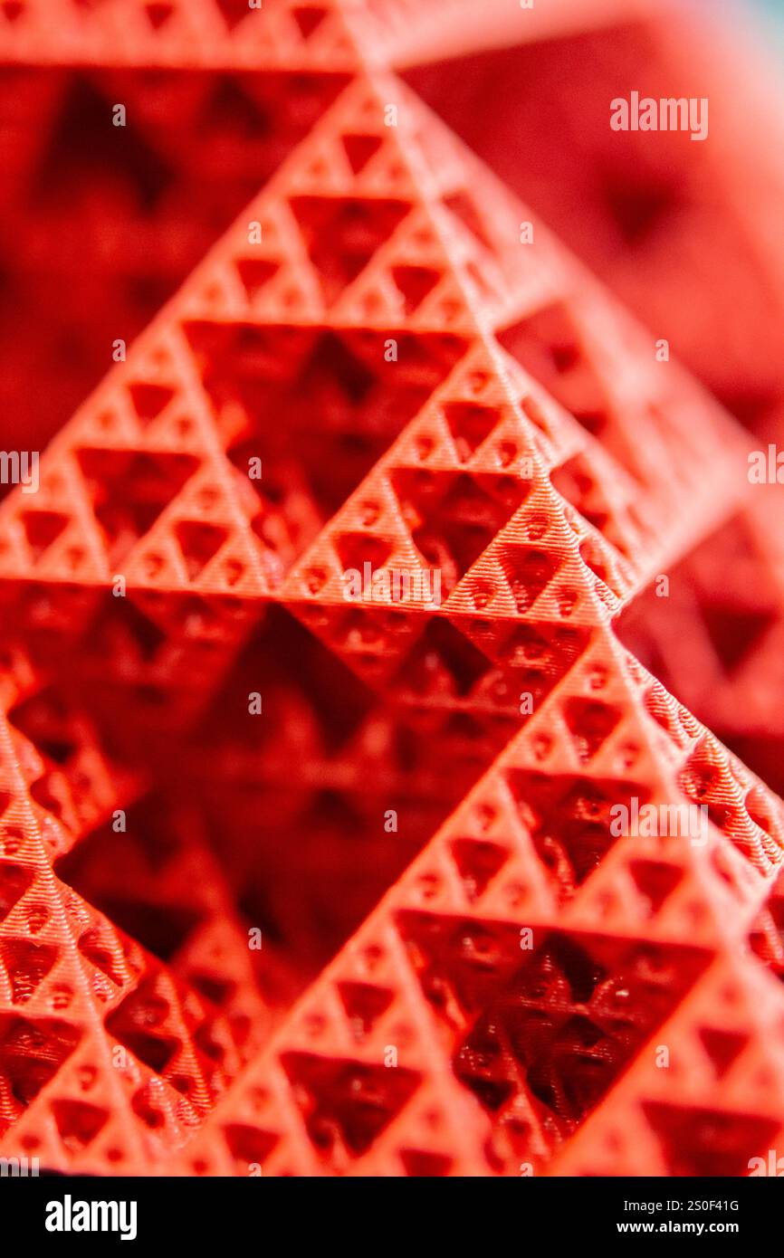 Art object printed on 3D printer from red melted plastic close-up ...
