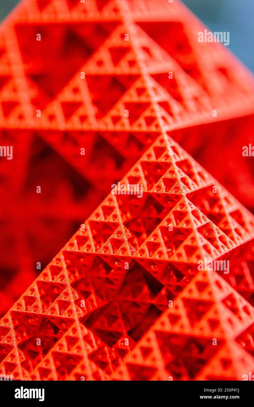 Art object printed on 3D printer from red melted plastic close-up ...