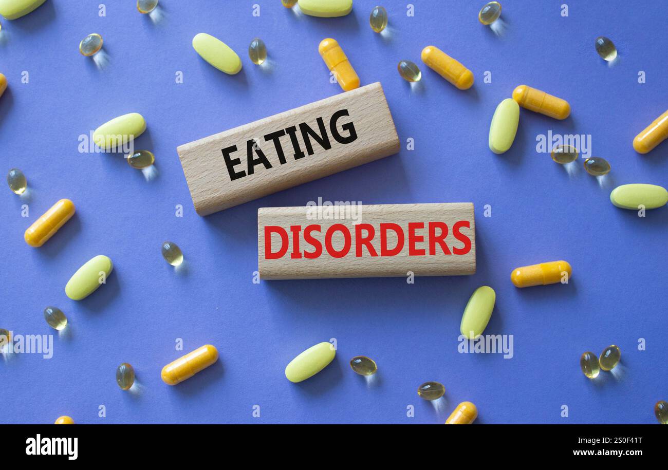 Eating Disorders symbol. Concept word. Eating Disorders on wooden ...