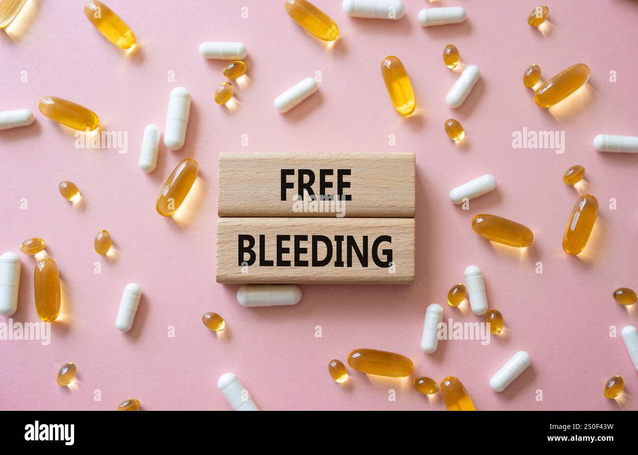 Free bleeding symbol. Concept words Free bleeding on wooden blocks ...