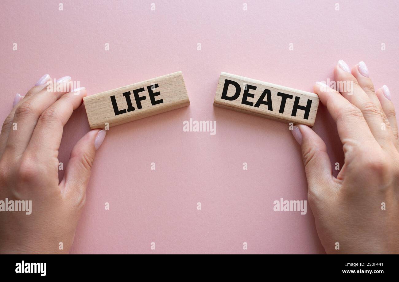 Life or Death symbol. Concept word Life or Death on wooden blocks ...