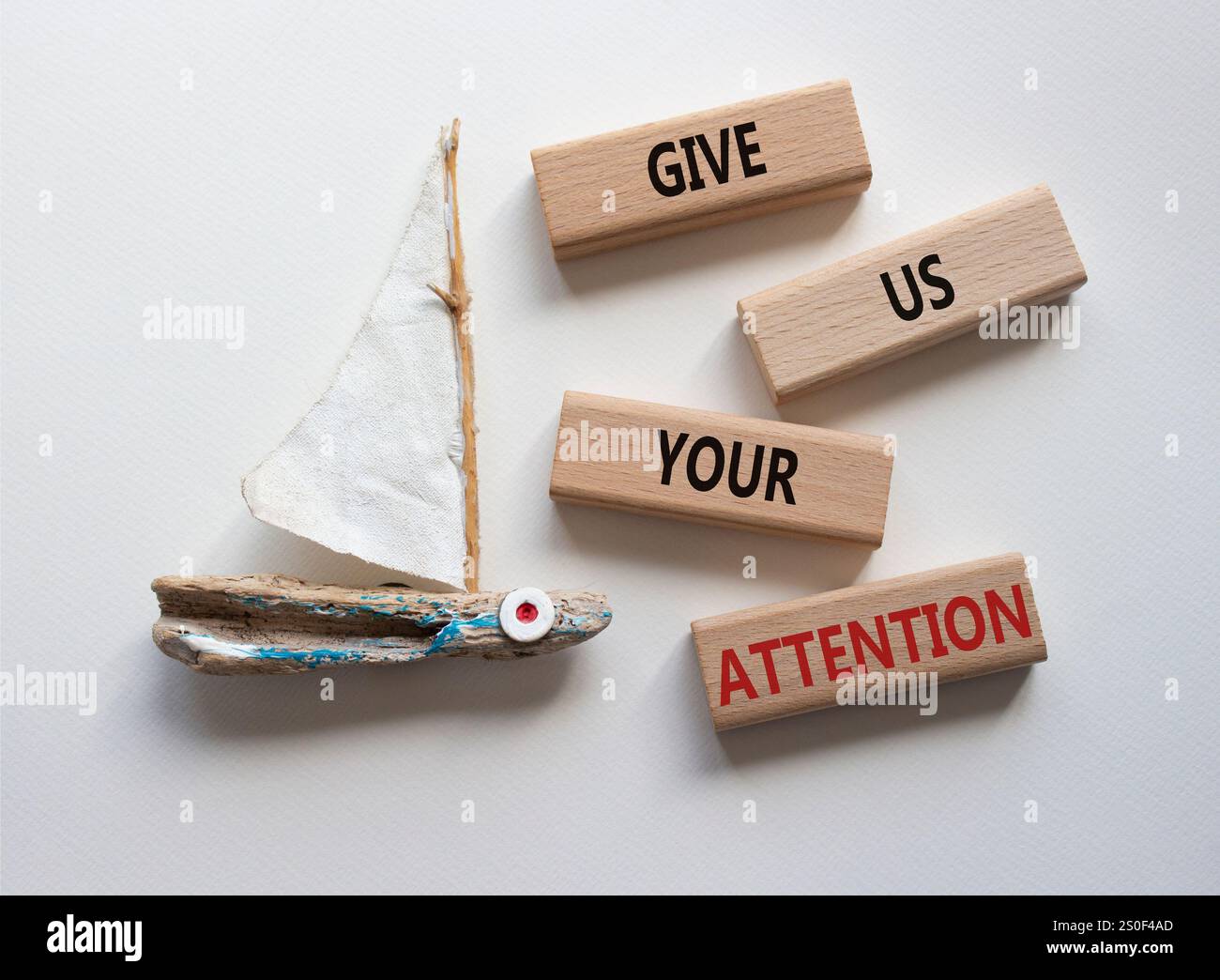 Attention symbol. Concept word Give us your attention on wooden blocks ...