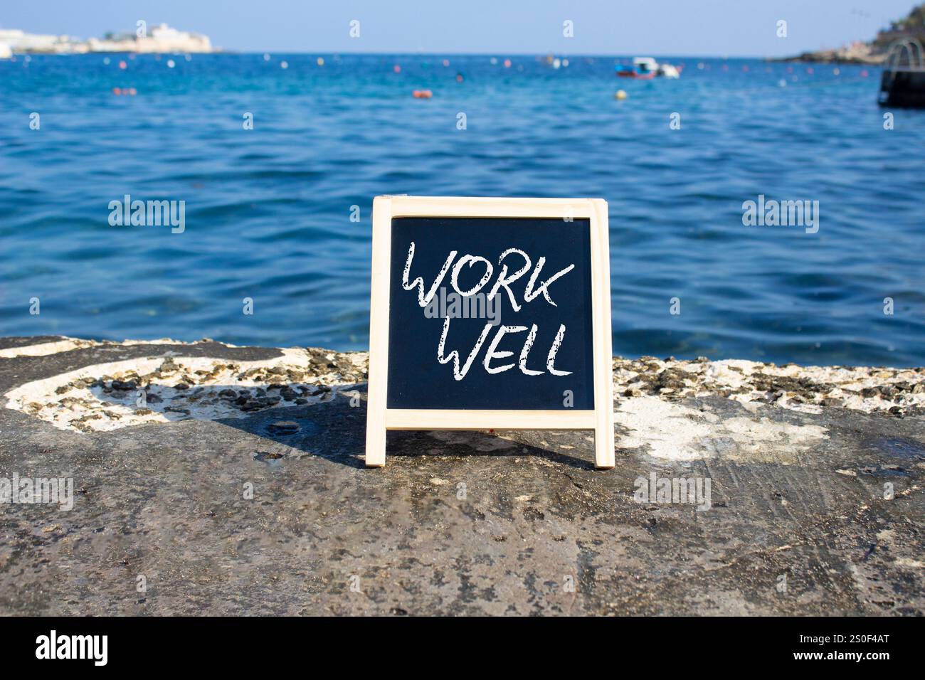Work Well symbol. Concept words Work well on black chalk background ...