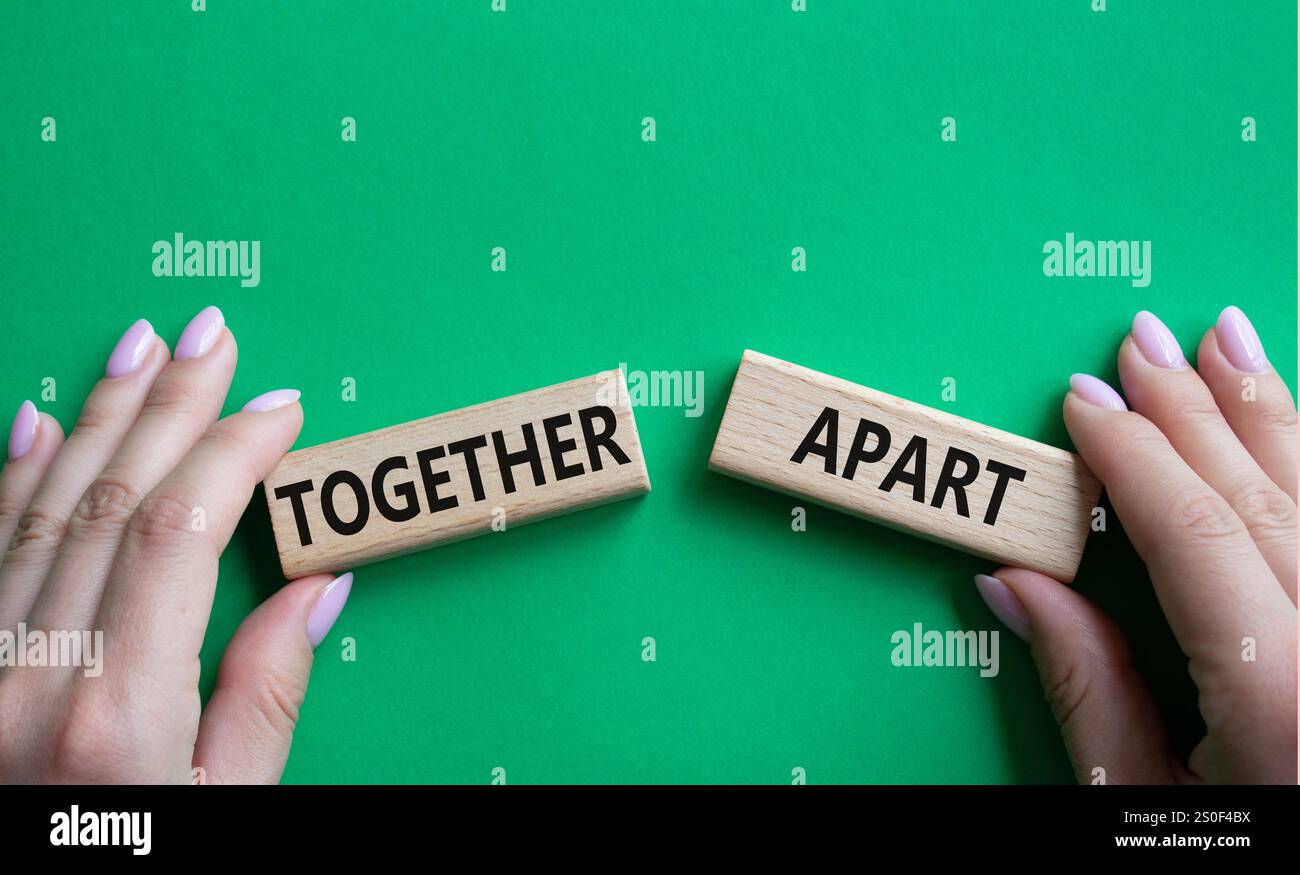 Together or Apart symbol. Concept word Together or Apart on wooden ...