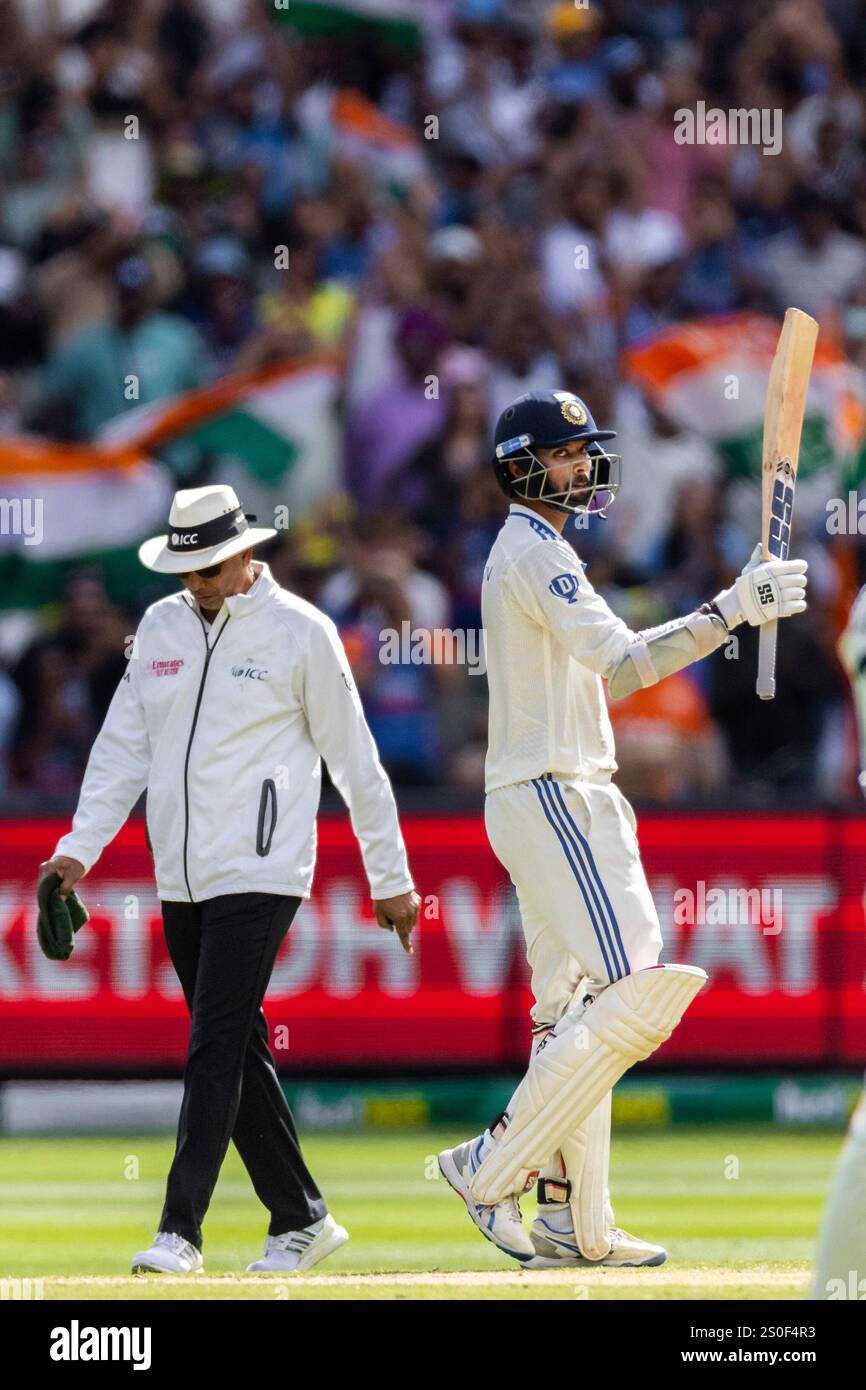 MELBOURNE, AUSTRALIA - DECEMBER 28: Washington Sundar of India raises ...